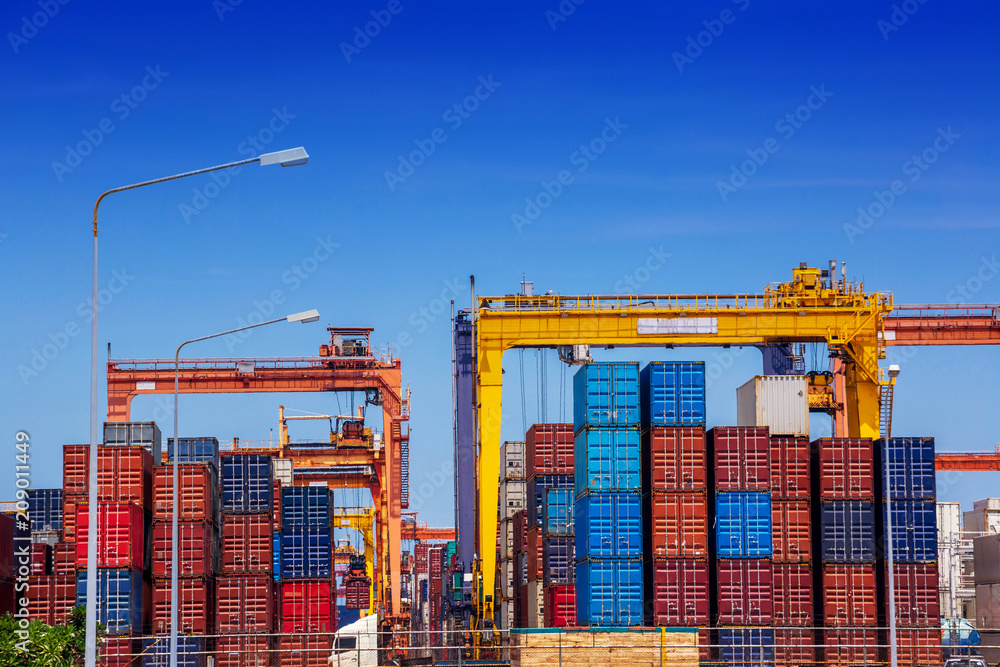 container cargo freight ship in container terminal yard is loading in ...