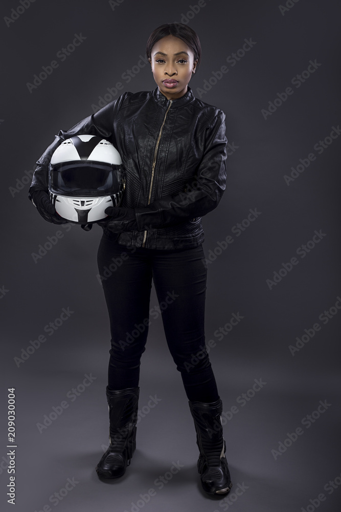Black female motorcycle biker or race car driver or stuntwoman wearing ...