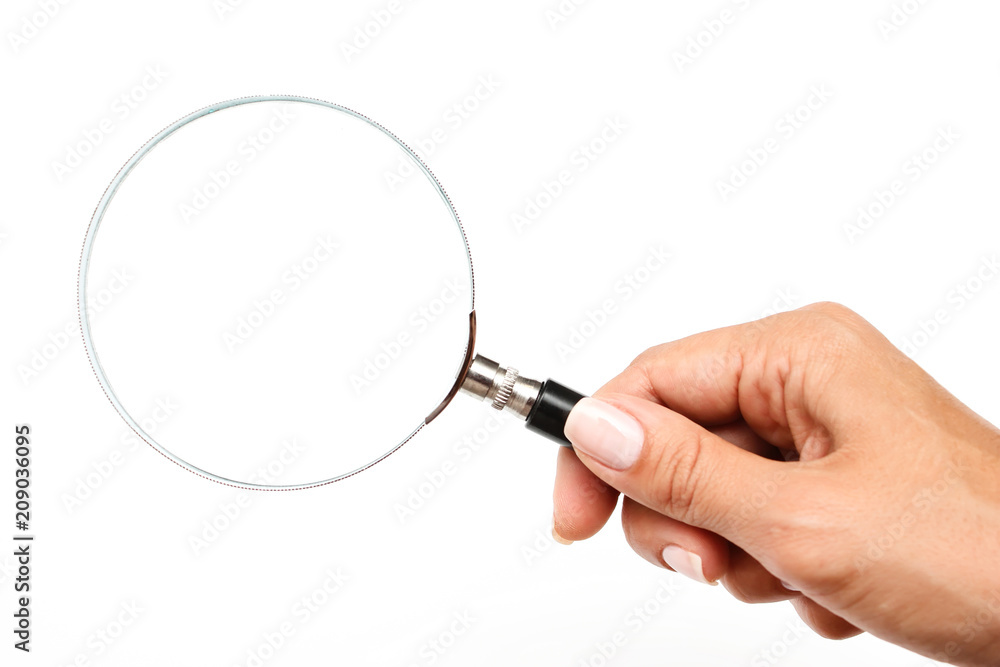 Female hand with a magnifying glass on a white background Stock Photo ...
