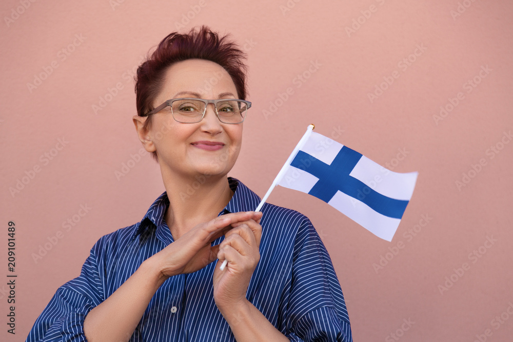 Woman holding Finnish flag. Nice portrait of middle aged woman 40 50 ...