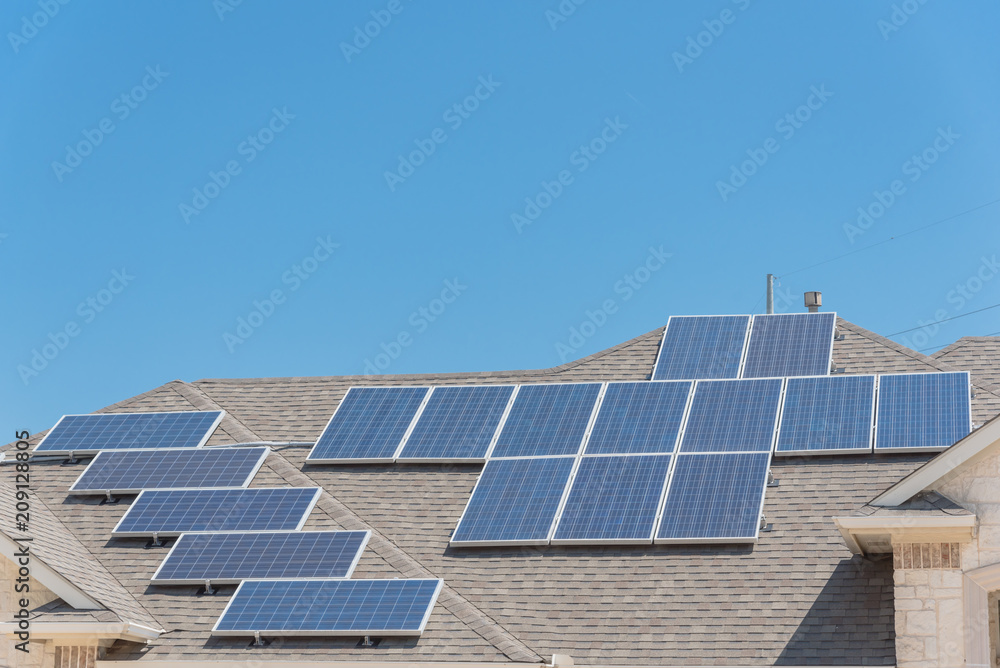 Close-up rail-less racking solar panel system on asphalt shingles ...