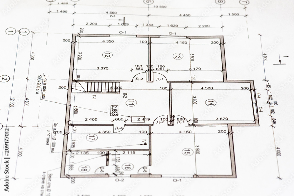 The architectural plan of the house is printed on a white sheet of ...