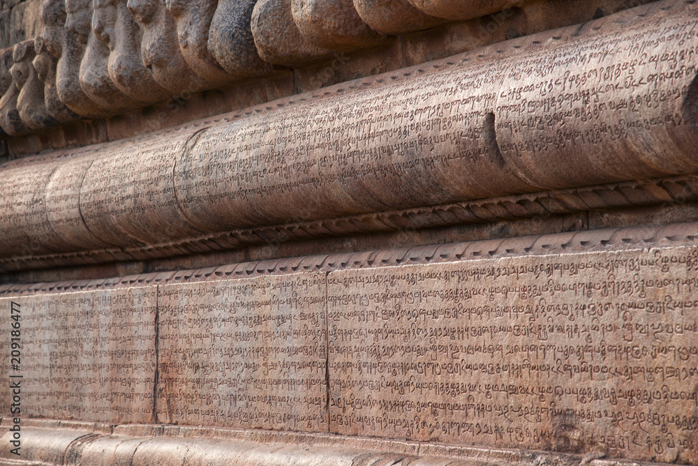 Carved inscriptions in Chola Grantha script and Tamil letters ...