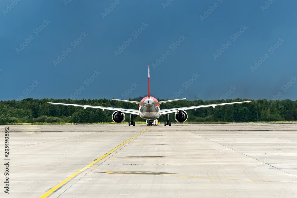 Poster Aircraft on the steering track at the airport, exactly in the ...