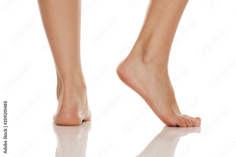 beautifully groomed bare feet on white background Stock Photo | Adobe Stock