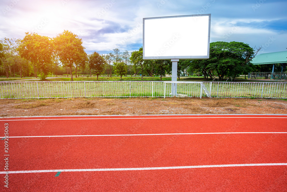 Digital blank scoreboard at football stadium with running track in ...