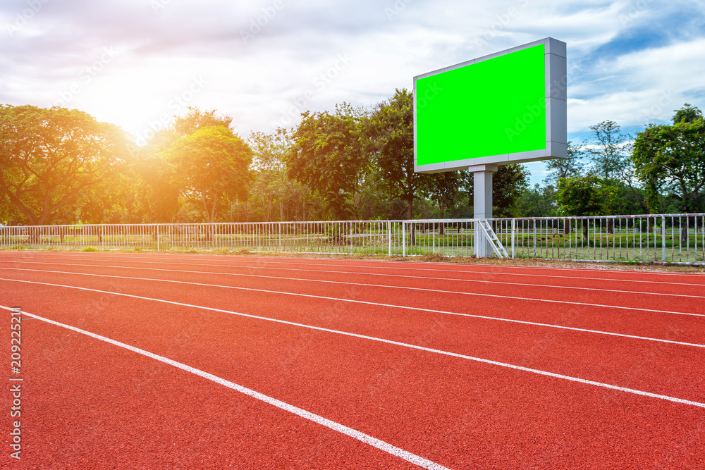 Digital blank scoreboard at football stadium with running track in ...