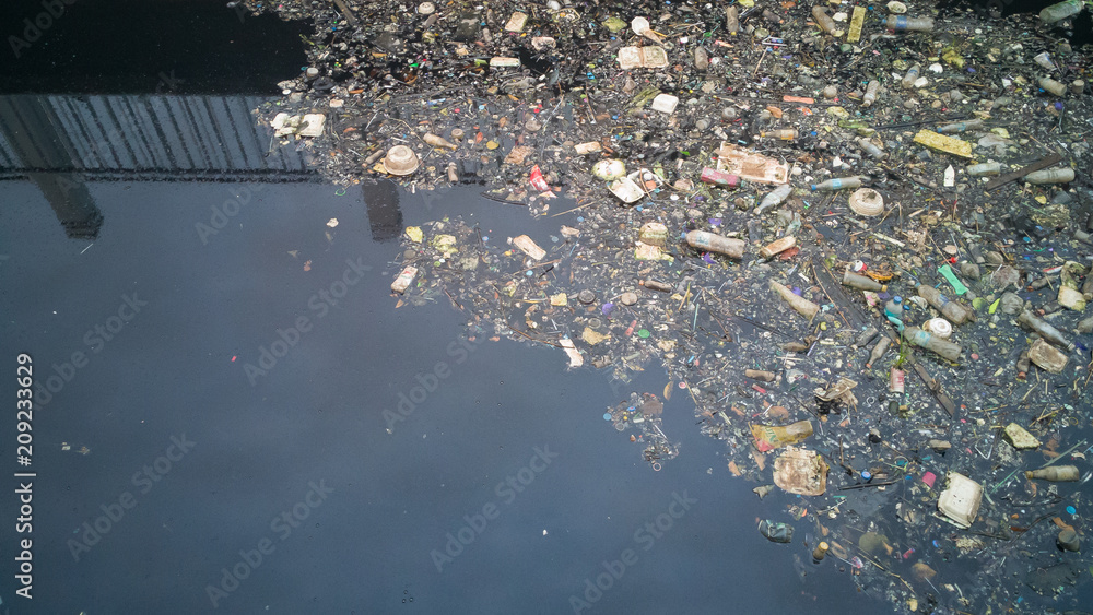 Water pollution effects Dirty garbage in canal. Stock Photo | Adobe Stock