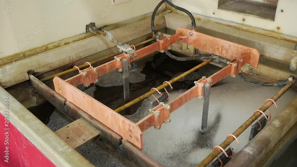 Galvanic bath, Engineering production. Circuit board in galvanic bath ...
