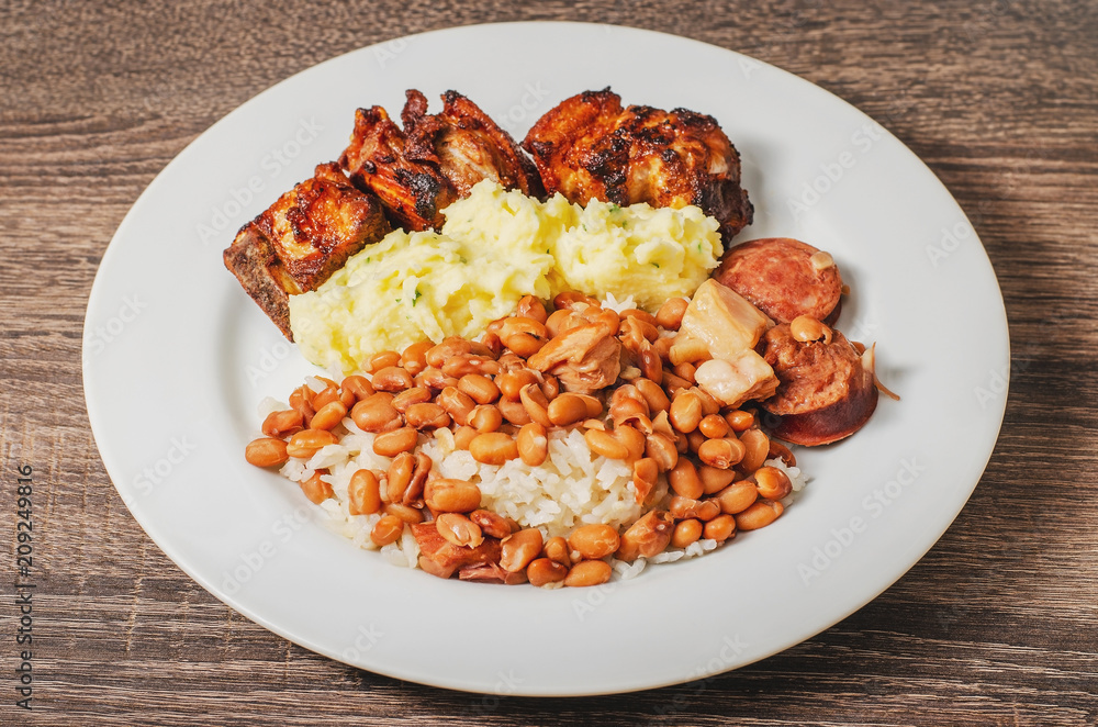 Brazilian cuisine, dish with rice and beans (arroz com feijao) seasoned ...