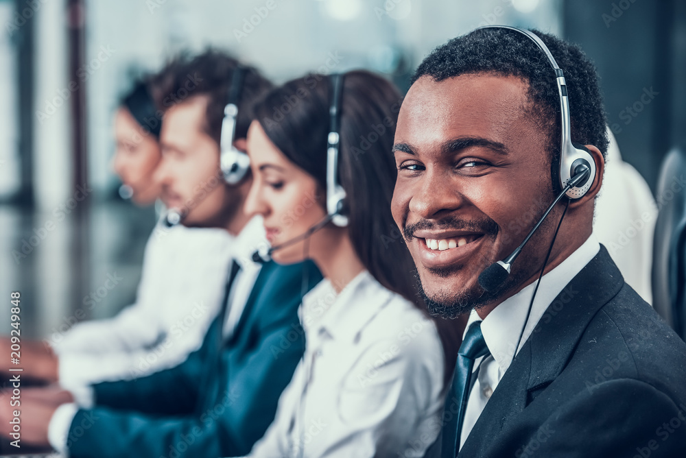 Multicultural young happy employees in call center Stock Photo | Adobe ...