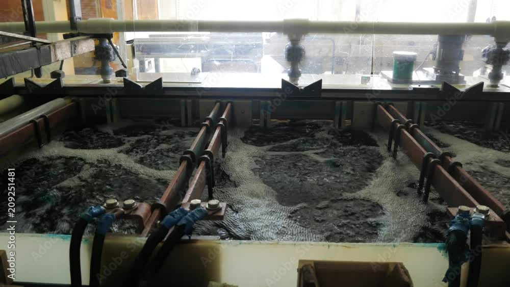 Galvanic bath, Engineering production. Circuit board in galvanic bath ...