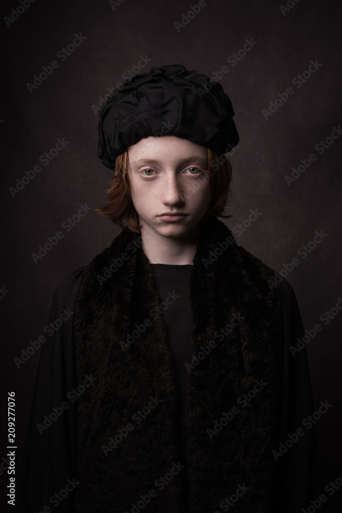 Painterly studio portrait of renaissance classic boy wearing black cap ...