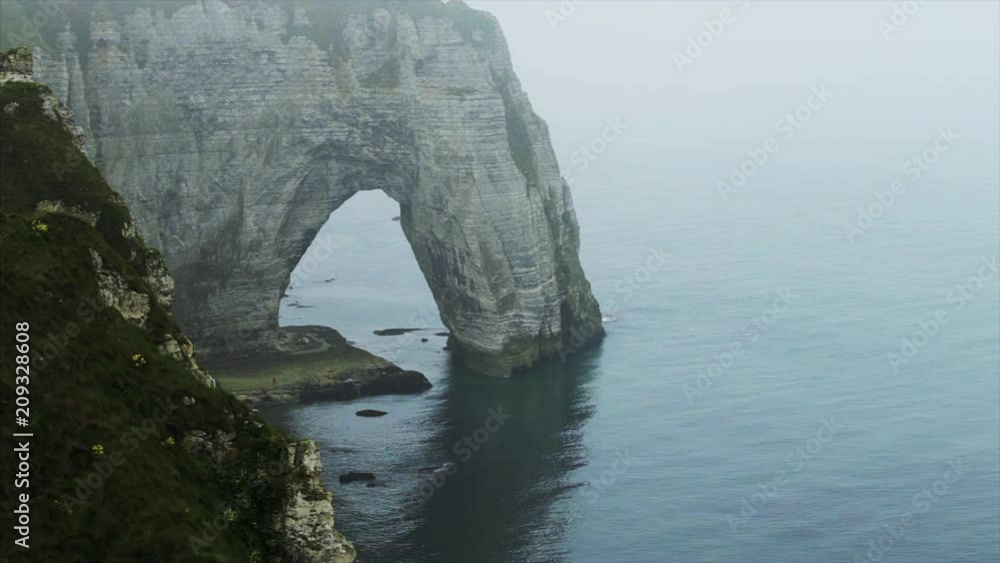 Famous rock arch in Etretat, France. Beautiful white chalk cliffs in ...
