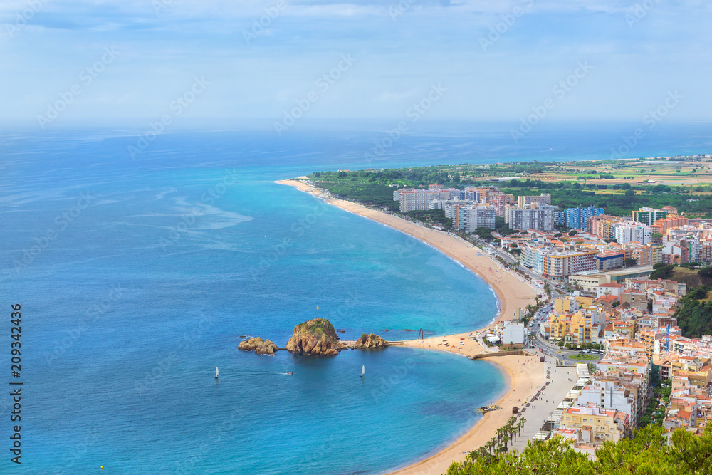 Coast, rock Sa Palomera and architecture of Spanish beach resort Blanes ...