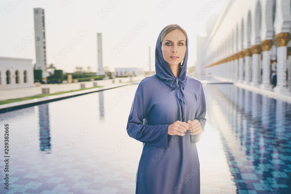 Traveling by Unated Arabic Emirates. Woman in traditional abaya ...