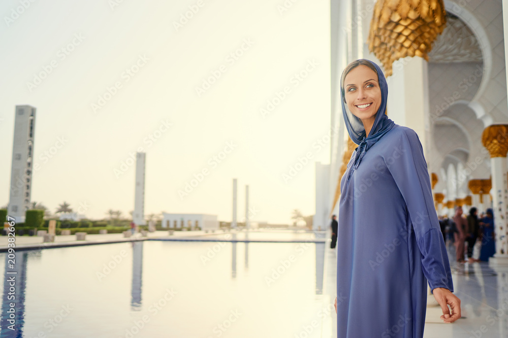 Traveling by Unated Arabic Emirates. Woman in traditional abaya ...