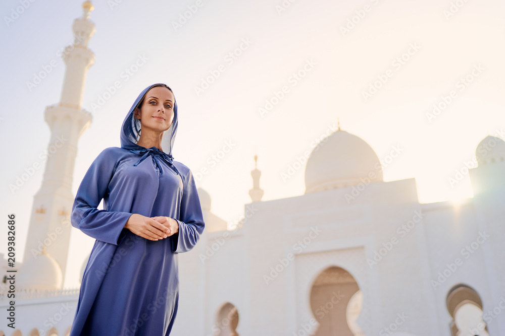 Traveling by Unated Arabic Emirates. Woman in traditional abaya ...