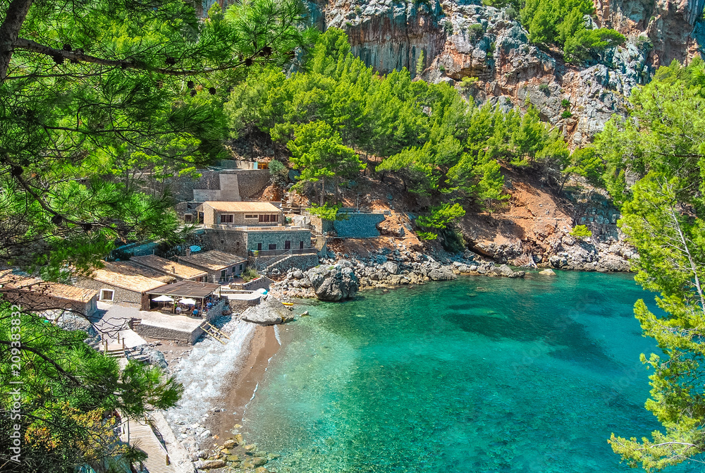 Sa Calobra bay, Mallorca, Spain. Houses and small beach at the bay ...