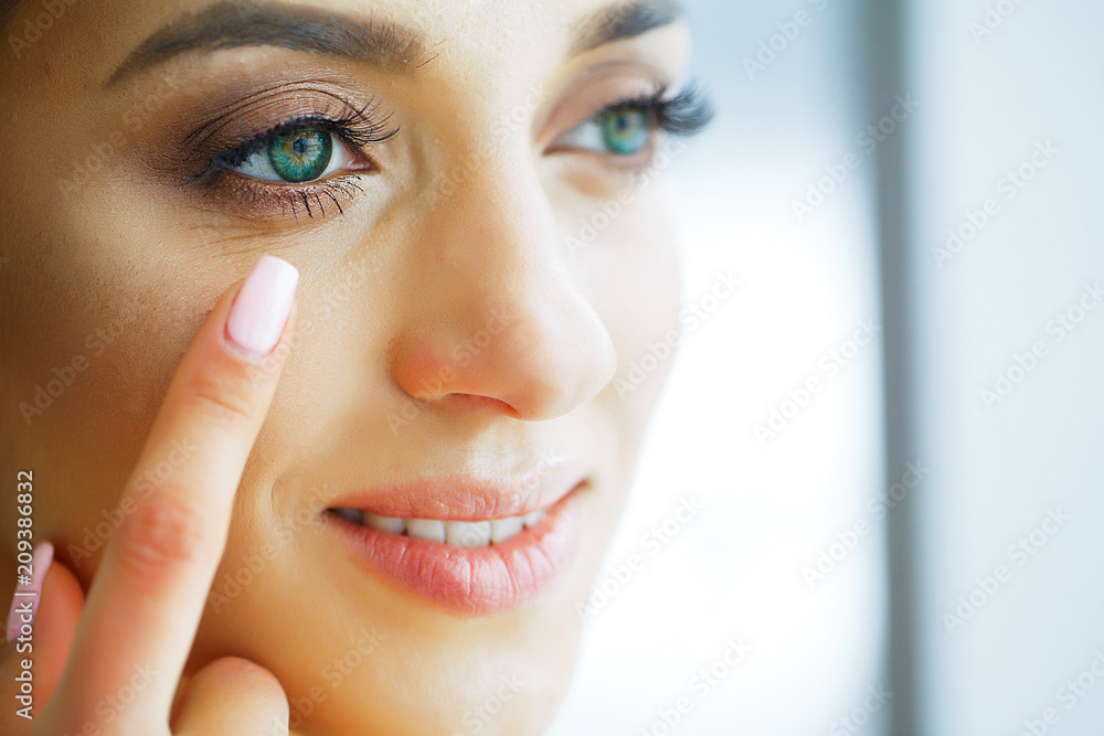 Health. Young Girl Holds Contact Lens In Hands. Portrait of a Beautiful ...
