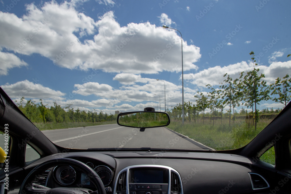 Interior view of sports car dashboard and panoramic windscreen of ...
