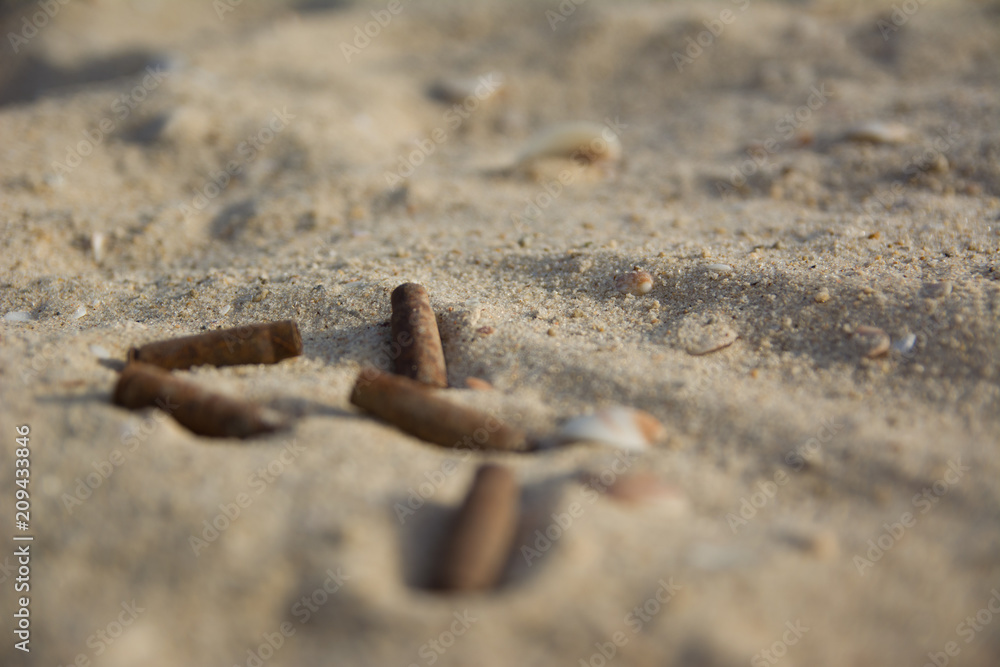 Shell casing of automatic weapons on the sand. signs of war Stock Photo ...
