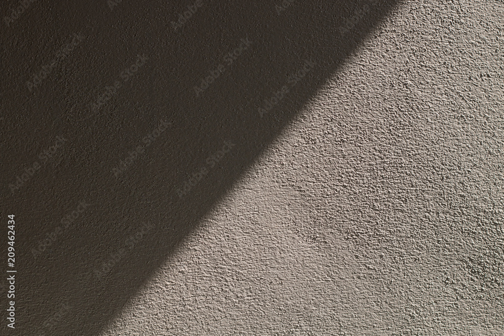 close up detail a cement wall with sun lights . empty space at ...