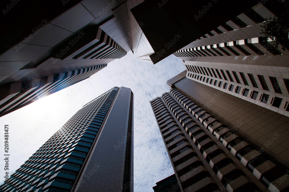 Skyscrapers tunnel of tall office towers surrounding the claustrophobic ...