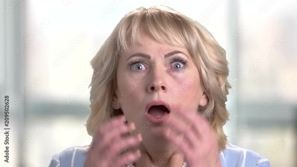 Face of shocked terrified woman. Female face with wide opened eyes and ...