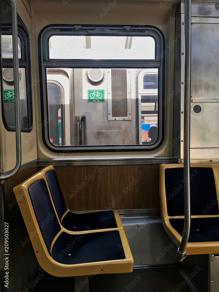 Interior of el train car in Chicago Loop, with view through window of ...