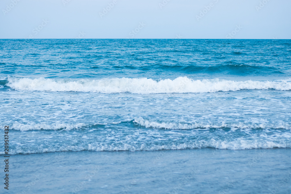 blue soft wave with clean ocean . sun light on sea . travel to the ...