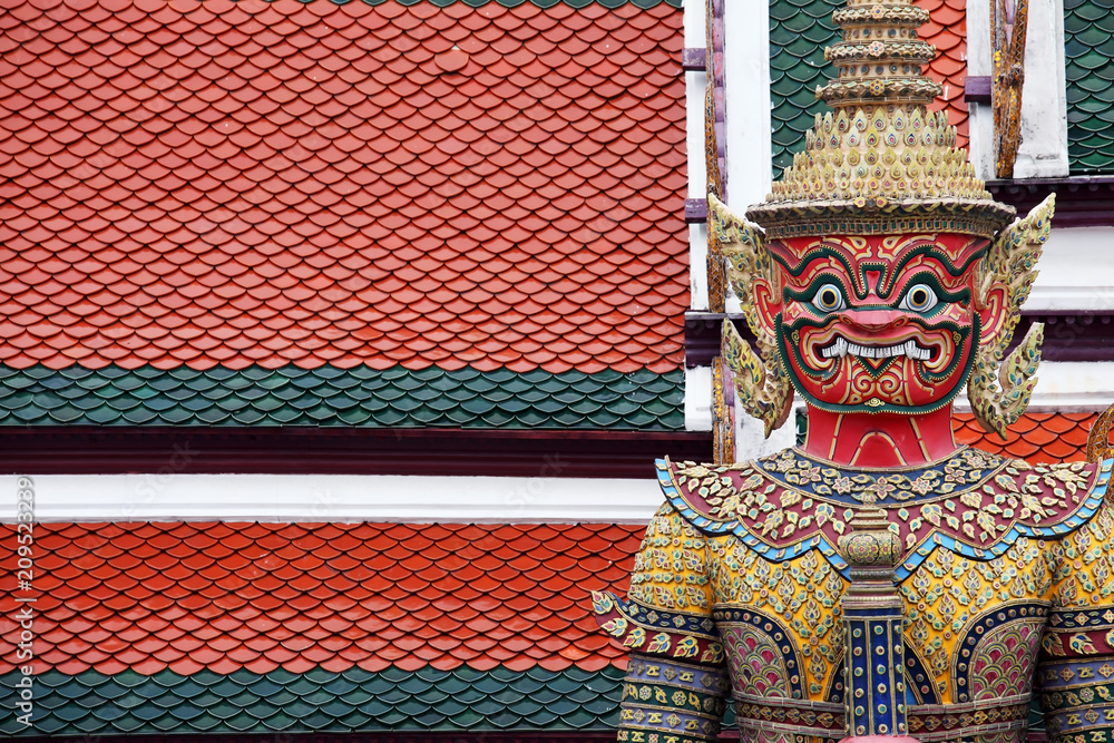 colorful ramayana demon statue with temple roof background Stock Photo ...