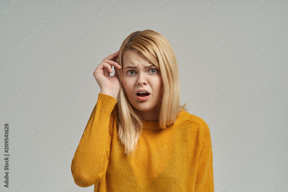 What do you mean by this? Indignant puzzled attractive young female ...