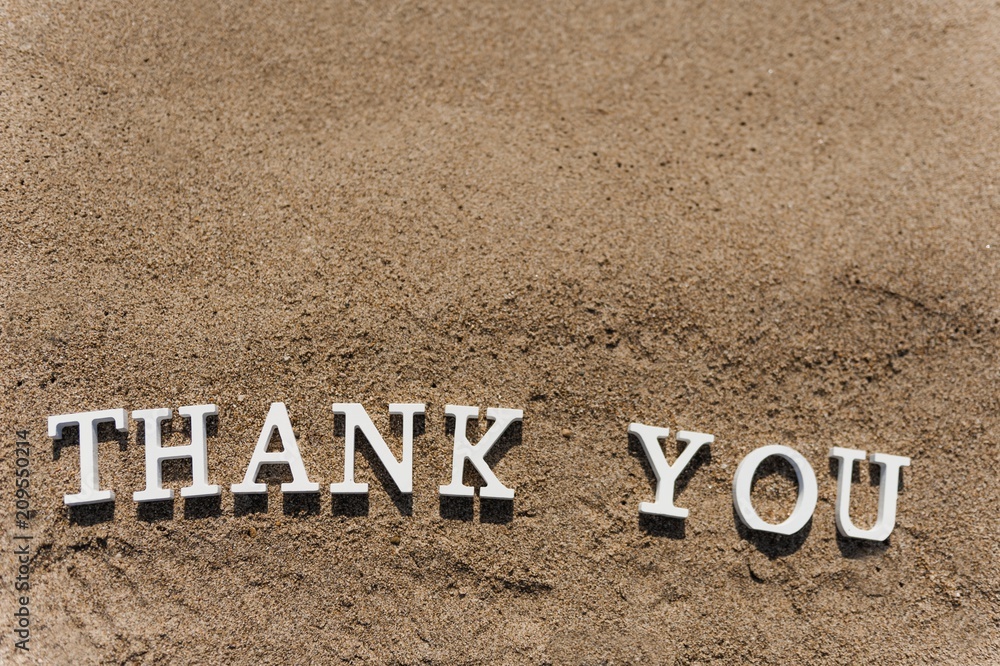 thank you word drawn on the beach sand Stock Photo | Adobe Stock