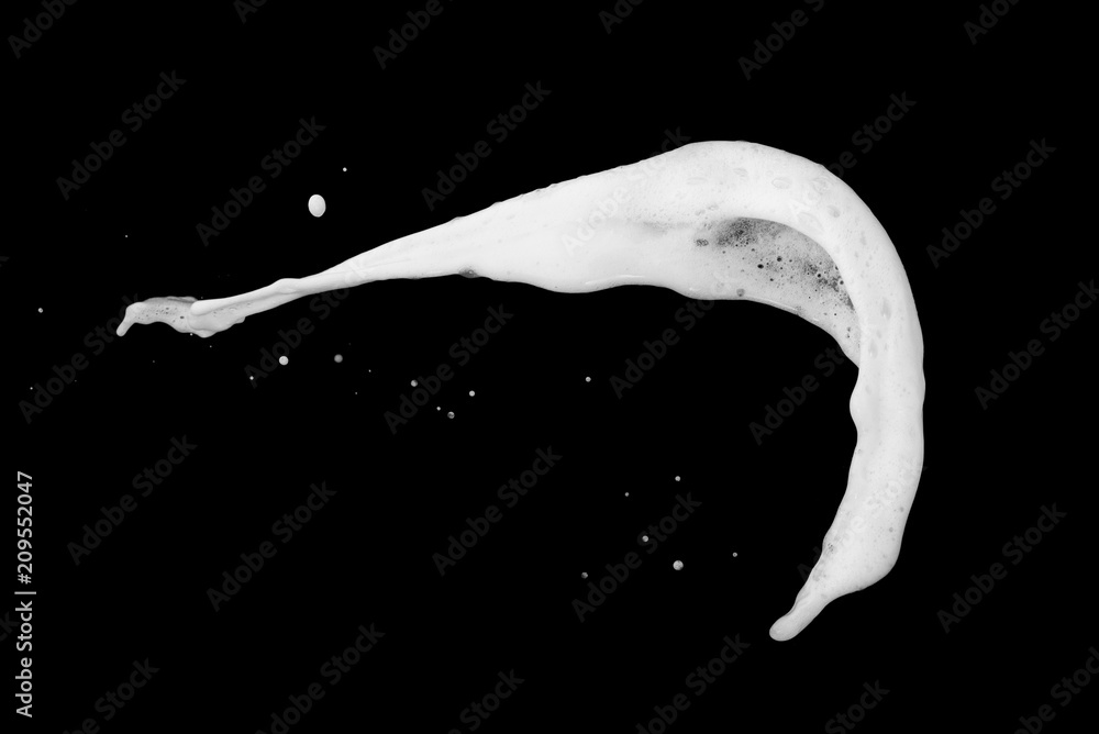 White bubble foam splash explosion in the air on black background ...
