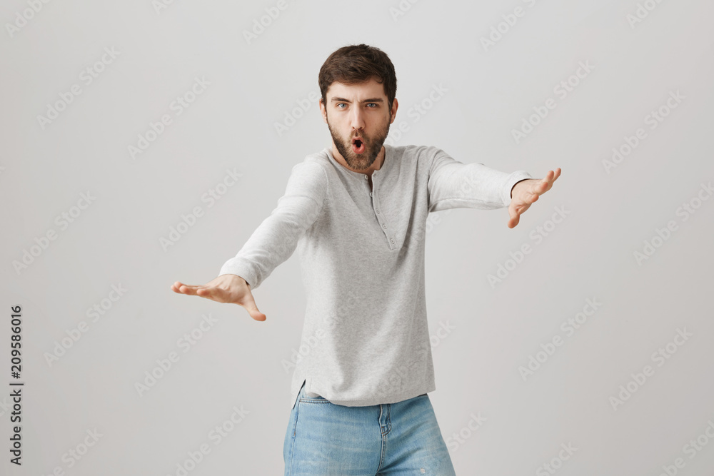 A Guy Pointing At A Crowd