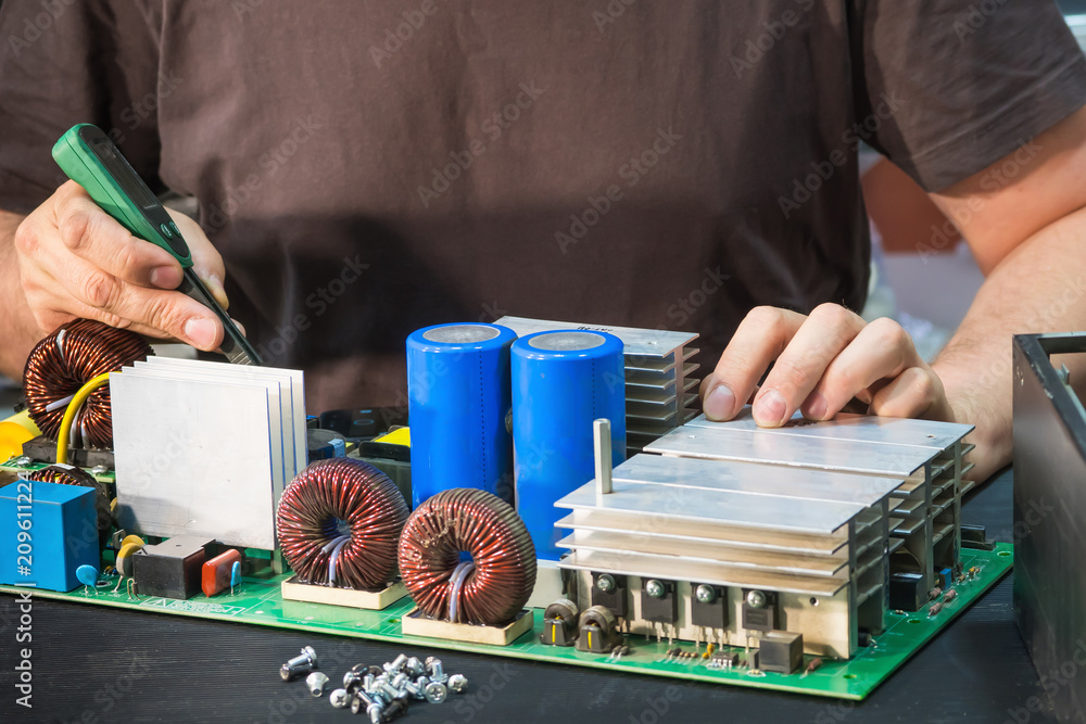 Repair of a powerful power supply unit, fault diagnosis Stock Photo ...