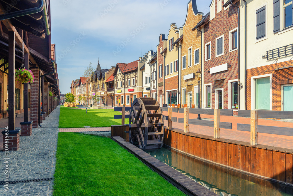 Streets of Dutch town with brick walls and water mill Stock Photo ...