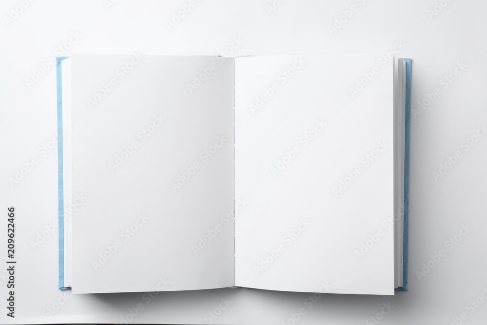 Mockup of open book on white background, top view Stock Photo | Adobe Stock