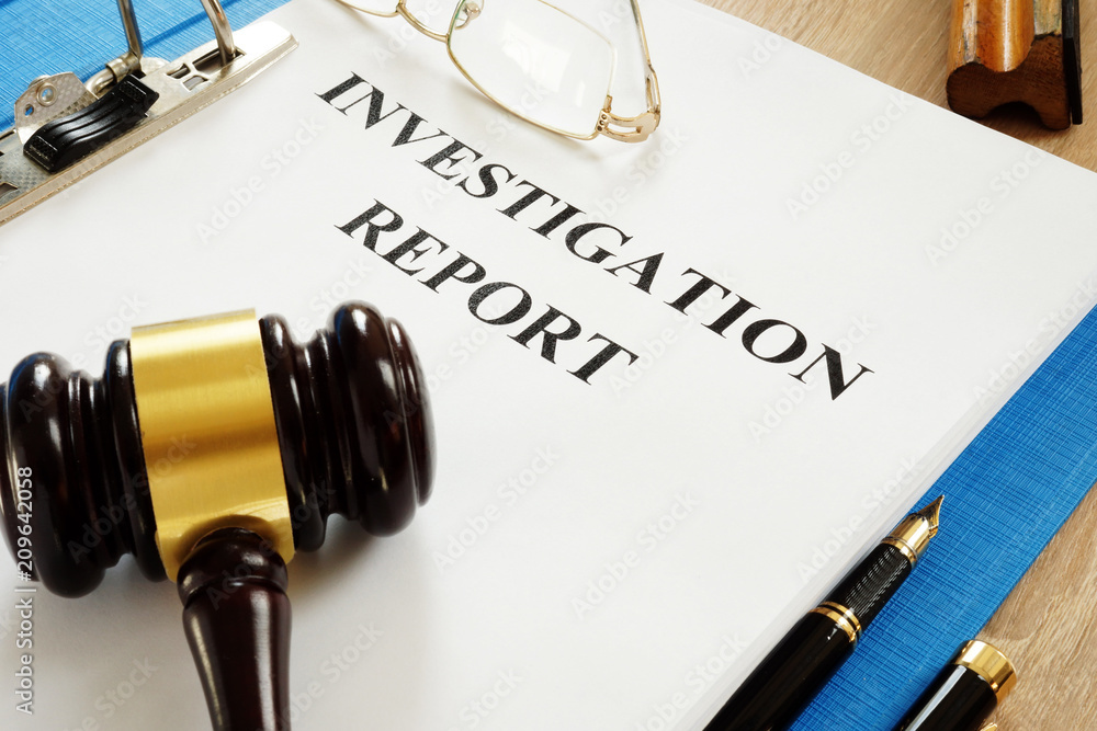 Investigation report and gavel on a table. Stock Photo | Adobe Stock