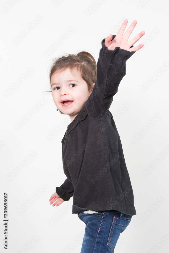 cute smiling happy little girl child waving goodbye Stock Photo | Adobe ...