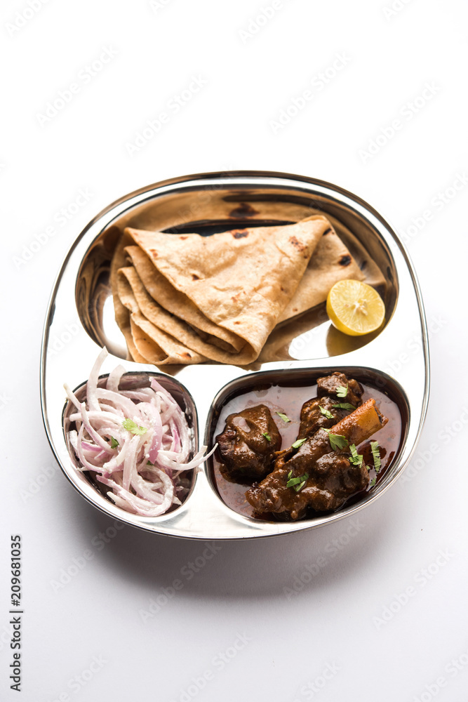 Mini chicken curry Thali with chapati/roti, popular indian lunch/dinner ...