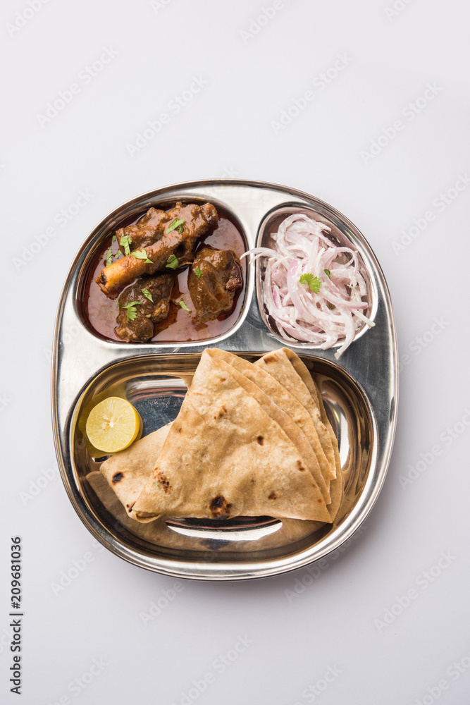 Mini chicken curry Thali with chapati/roti, popular indian lunch/dinner ...