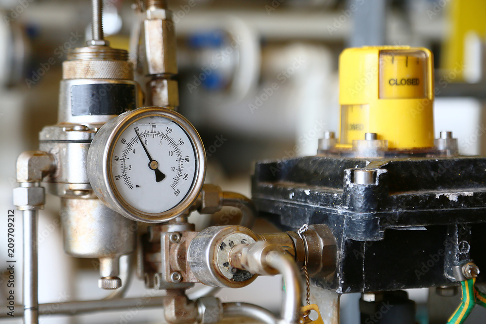 Pressure gauge using measure the pressure in production process. Worker ...
