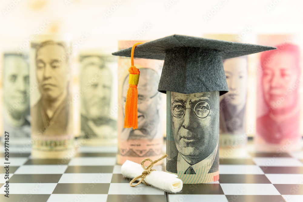 Graduation cap put on AUD 20 dollar bill, a diploma or certificate ...