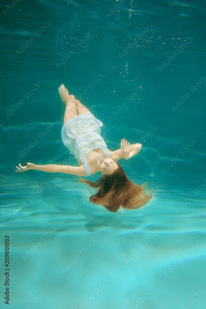 Underwater scene. Girl mermaid with healthy shiny beautiful long hair ...