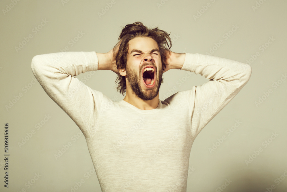 madness. sleepy yawning man with long uncombed hair, morning wake up ...