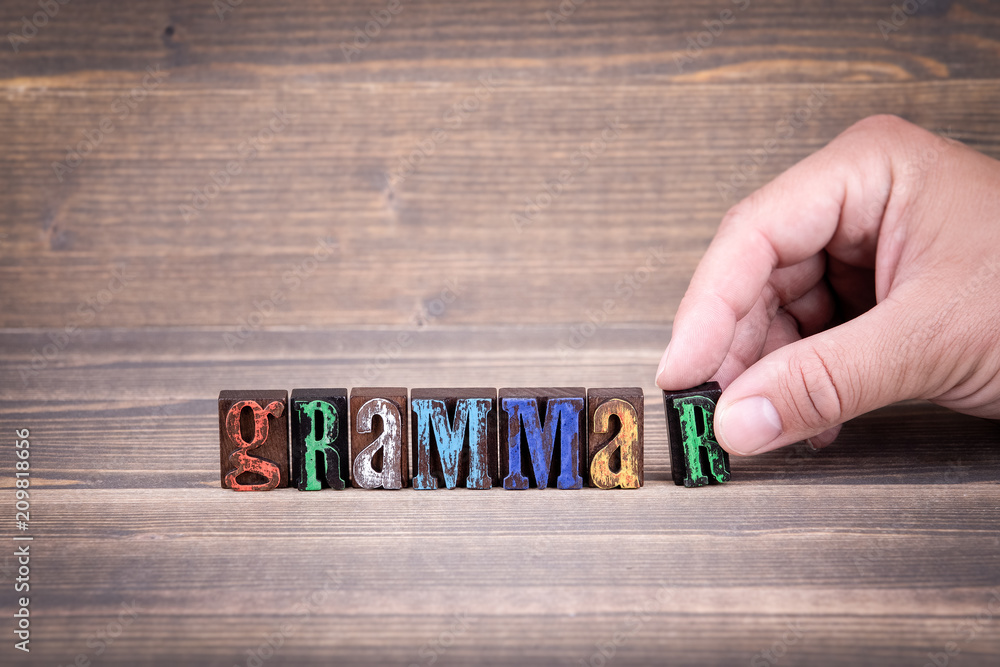 grammar education and business concept. Wooden letters on the office ...