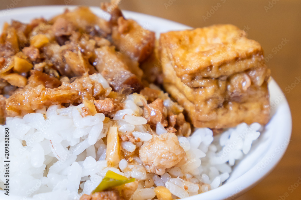 Taiwan famous food - Braised pork and fried tofu on rice. Soy-stewed ...