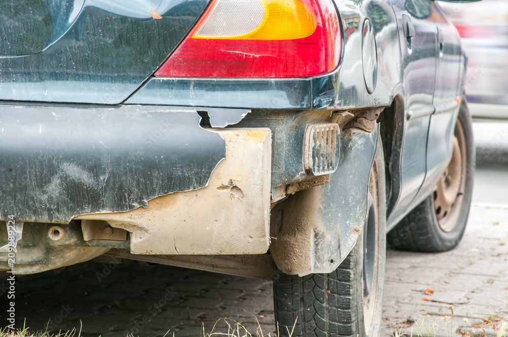 Broken and damaged rear bumper on the car in crash accident or ...